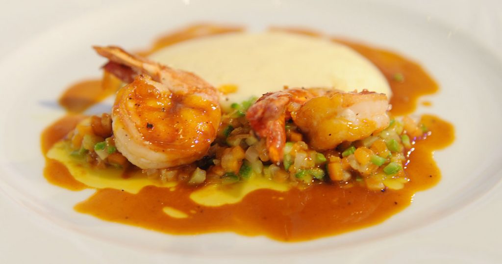 Grilled crayfish with mashed potatoes in white truffle oil